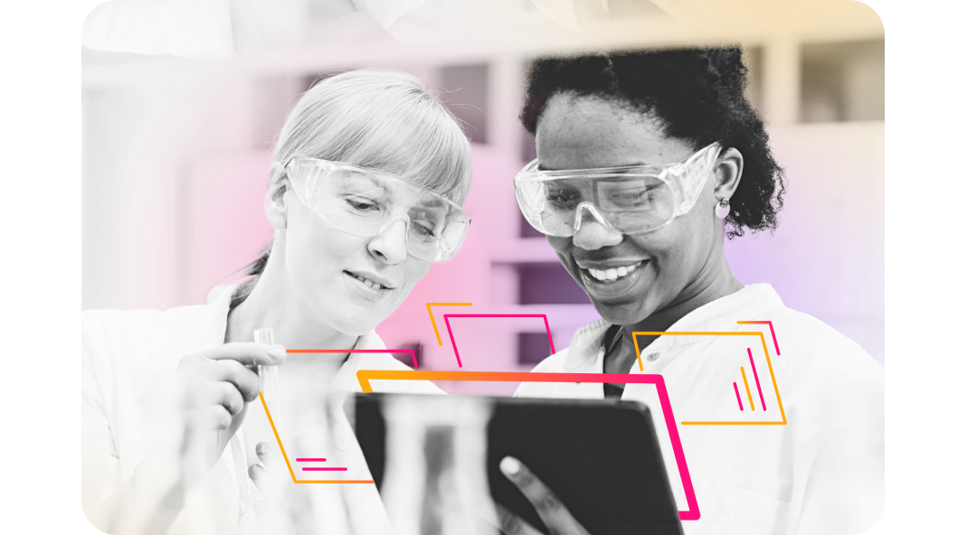 Two coworkers looking at a tablet